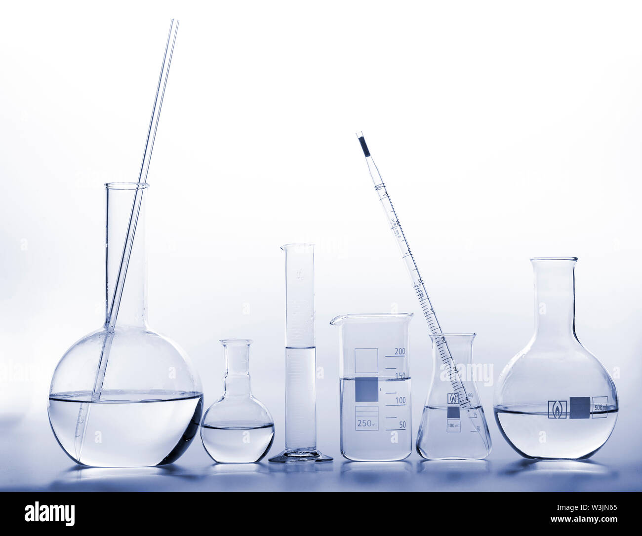 Test-tubes with reflections on a white and blue background. Laboratory ...