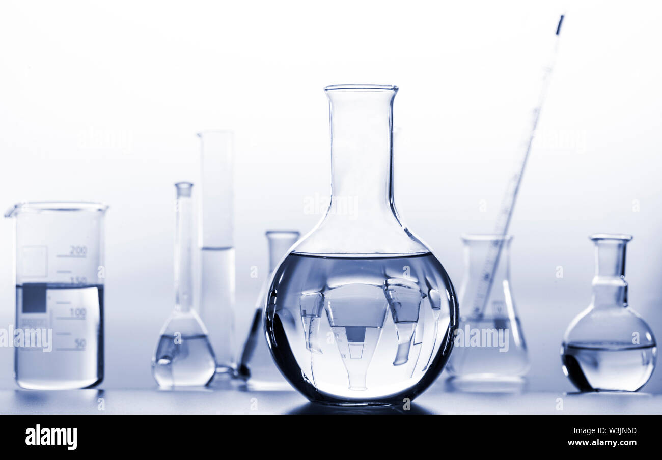 Test-tubes with reflections on a white and blue background. Laboratory ...