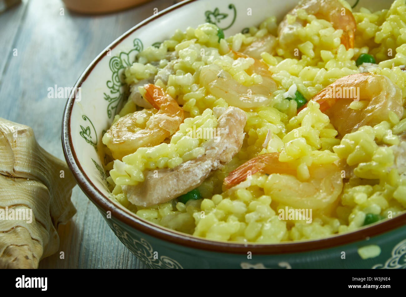 Paella with cod and shrimp, classic Spanish rice dish Stock Photo - Alamy