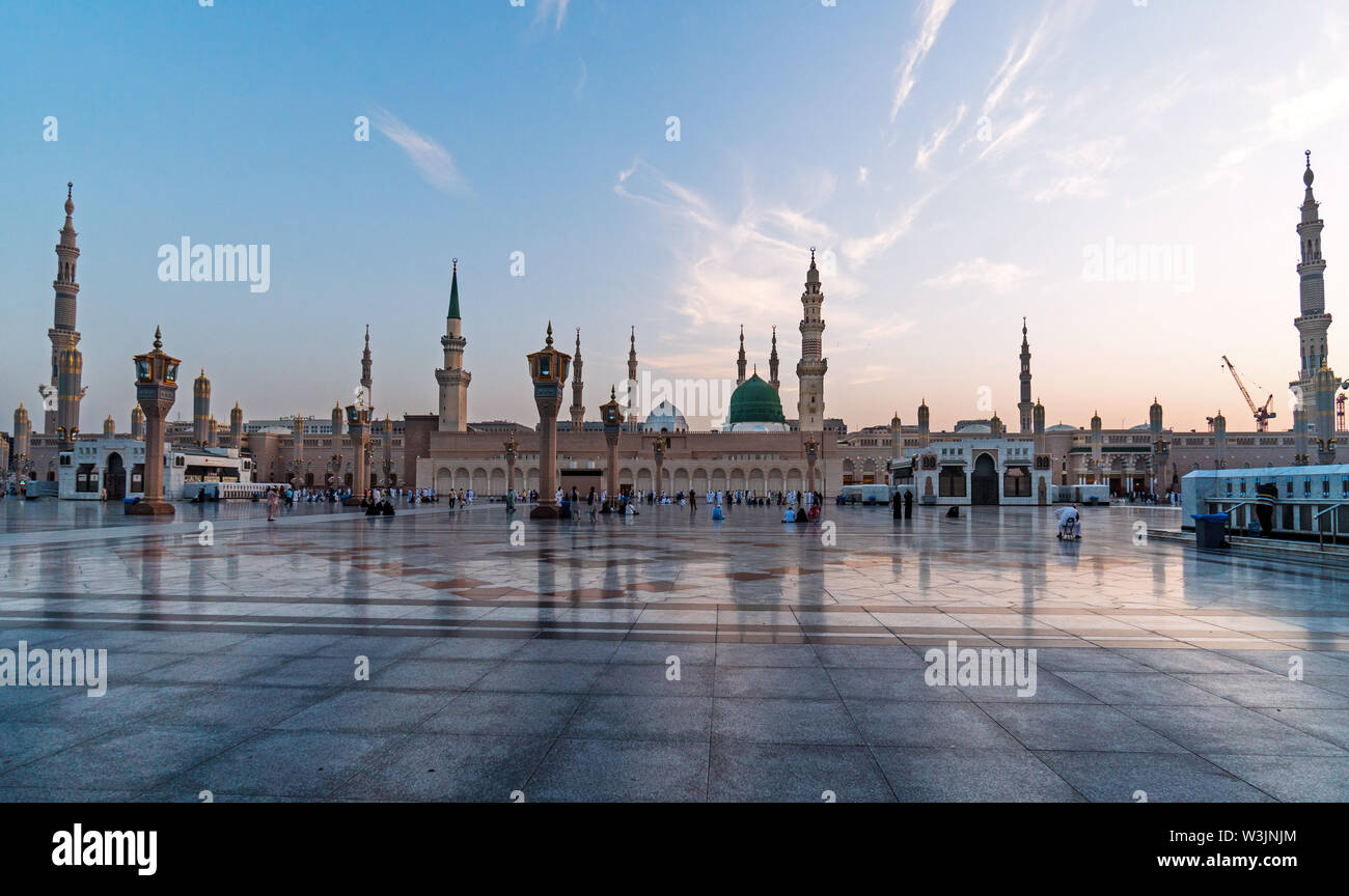 MEDINA, SAUDI ARABIA - JUNE 25: Muslims marching in front of the mosque ...