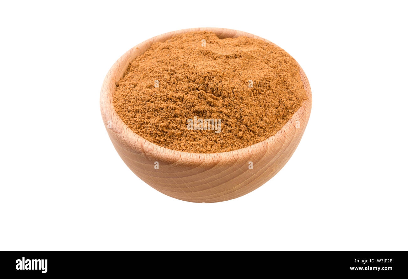 milled or ground nutmeg in wooden bowl isolated on white background. 45 ...