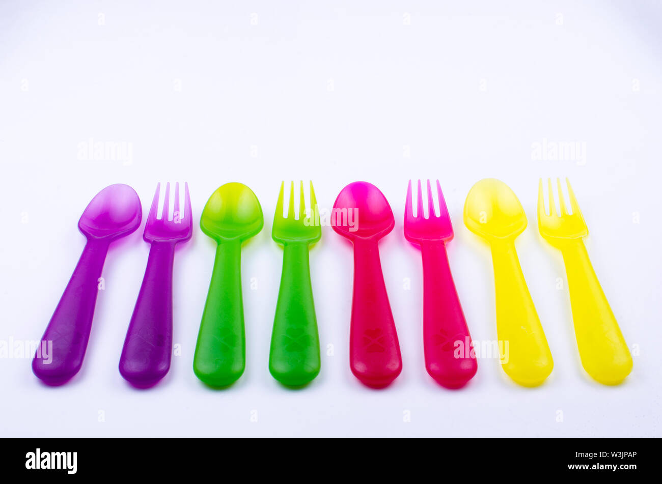 Plastic spoon and fork color Stock Photo - Alamy