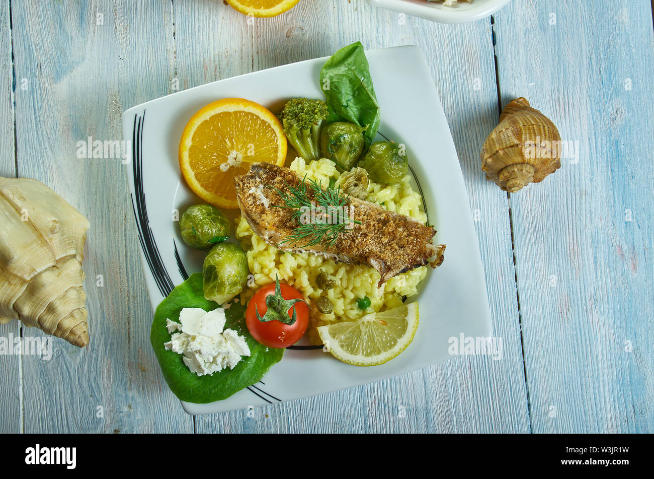 Crispy snapper with salsa verde risotto , Seafood risotto Stock Photo ...