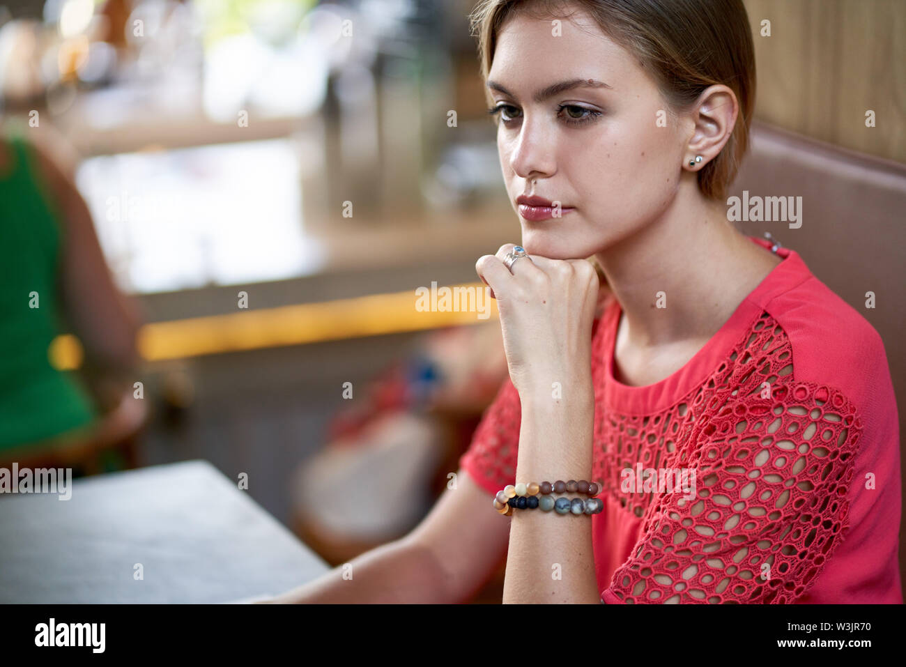 Closeup lifestyle portrait of pretty focused blonde haired russian Gen ...