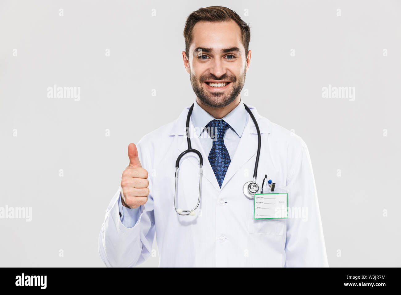 Portrait of happy young medical doctor with stethoscope smiling at ...