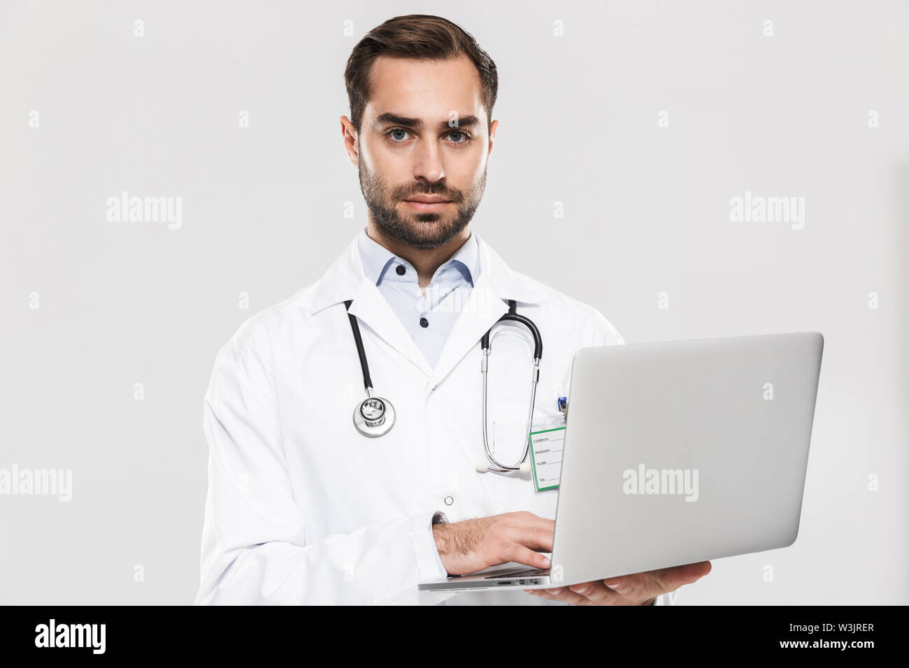 Portrait of smart young medical doctor with stethoscope working in ...