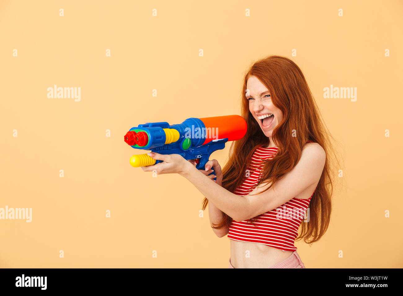 Caucasian girl holding water gun hi-res stock photography and images ...
