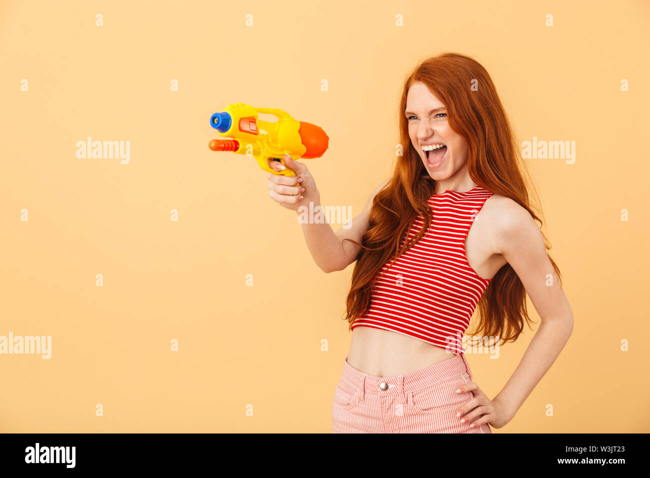 Caucasian girl holding water gun hi-res stock photography and images ...