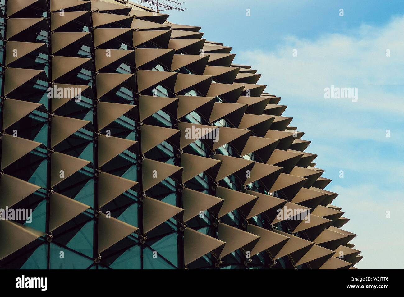 Beautiful low angle shot of a spiky modern architecture in an urban ...