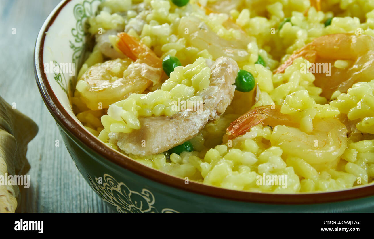 Paella with cod and shrimp, classic Spanish rice dish Stock Photo - Alamy