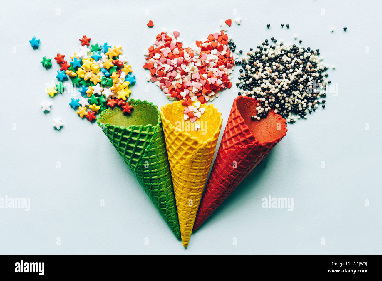 Small caramels of different shapes and colors are scattered on the ...