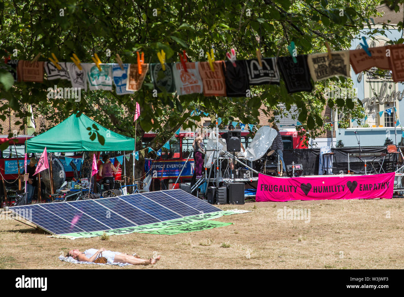 London, UK. 16 July, 2019. A stage and solar panels prepared by climate ...