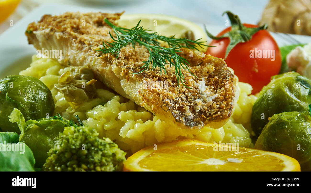 Crispy snapper with salsa verde risotto , Seafood risotto Stock Photo ...