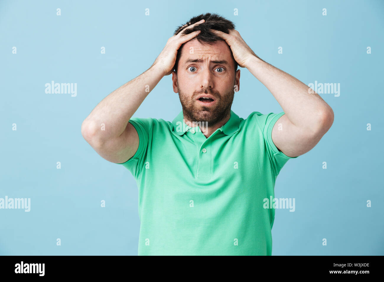Image of scared confused young handsome bearded man posing isolated ...