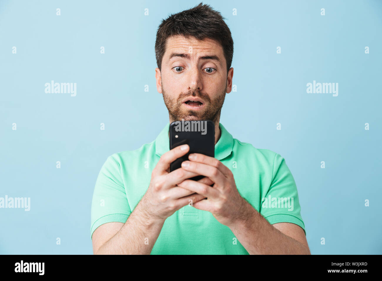 Image of a shocked scared young handsome bearded man posing isolated ...