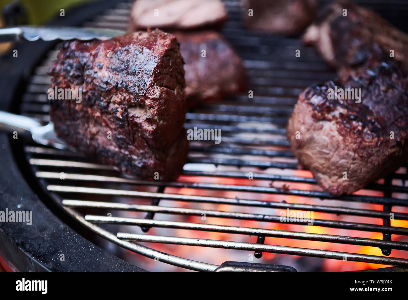 Roast beef at barbecue. Low temperature grilling barbecue Stock Photo ...