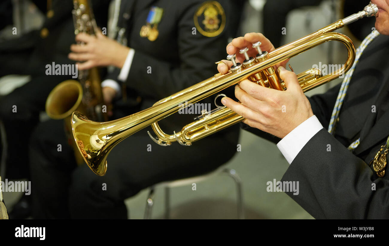 The trumpeter is playing on a silver trumpet. Trumpet players Stock ...