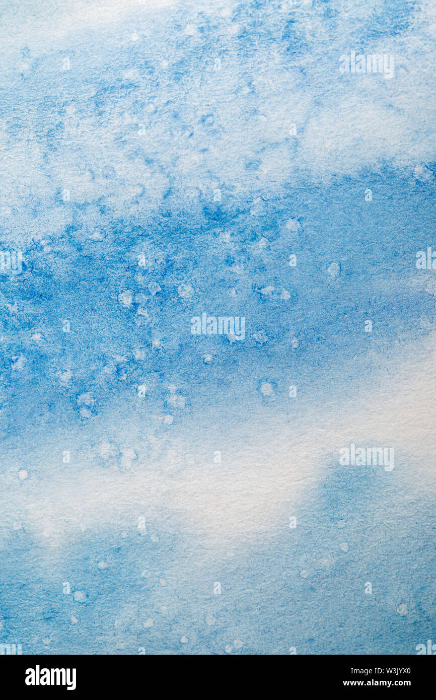 close up view of blue watercolor paint spill with dots on textured ...