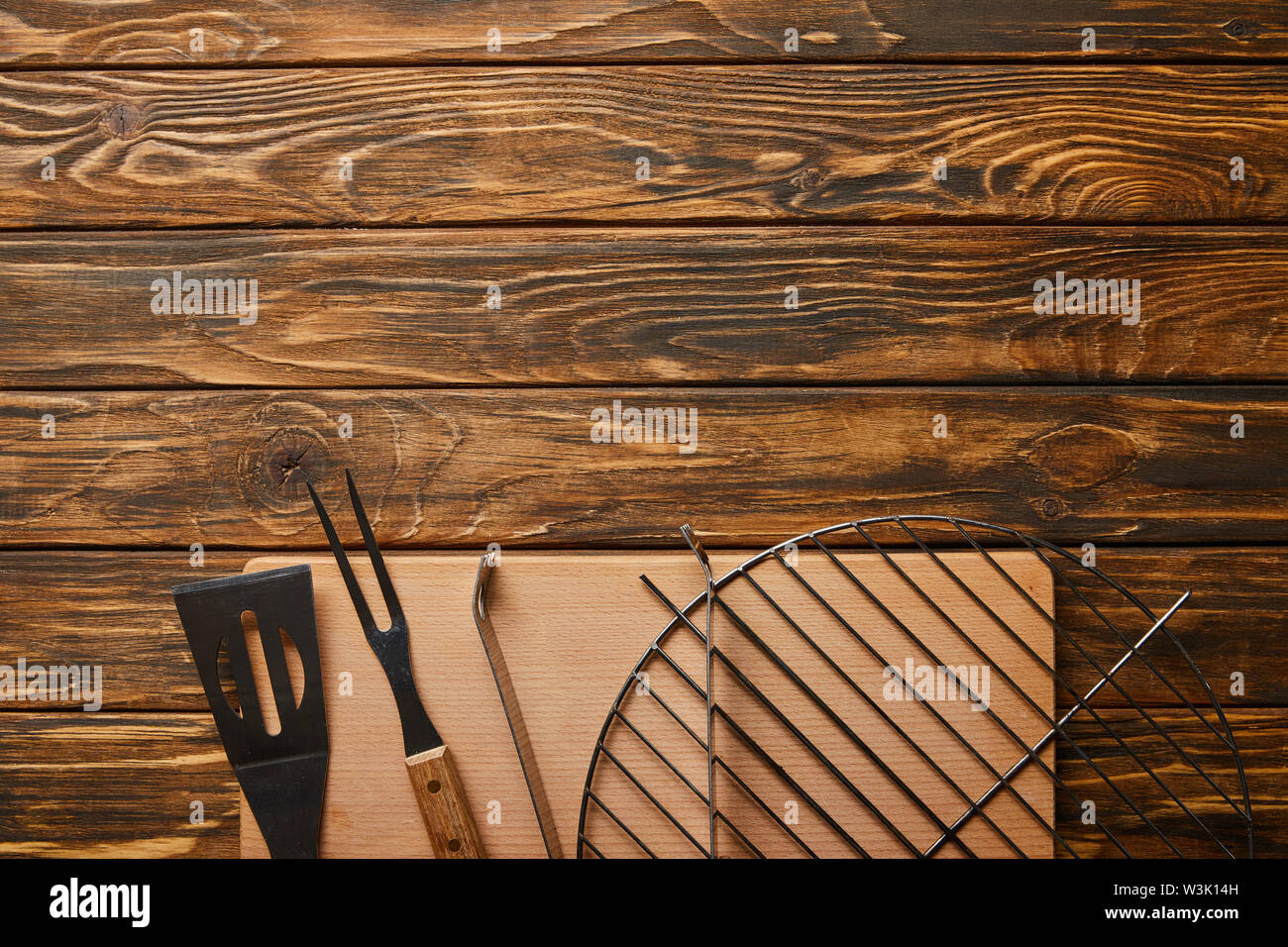 top view of barbecue cooking equipment on wooden table Stock Photo - Alamy