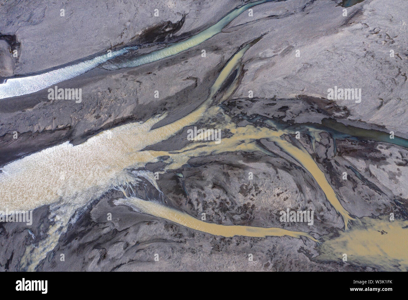 Aerial drone view of glacial river system transporting water from the ...