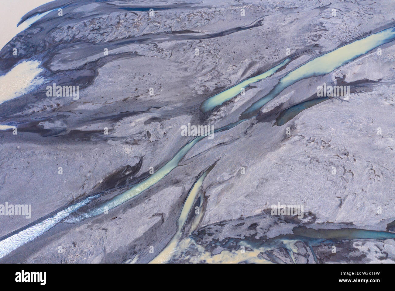 Aerial drone view of glacial river system transporting water from the ...