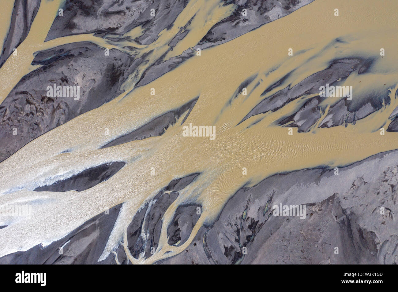 Aerial drone view of glacial river system transporting water from the ...