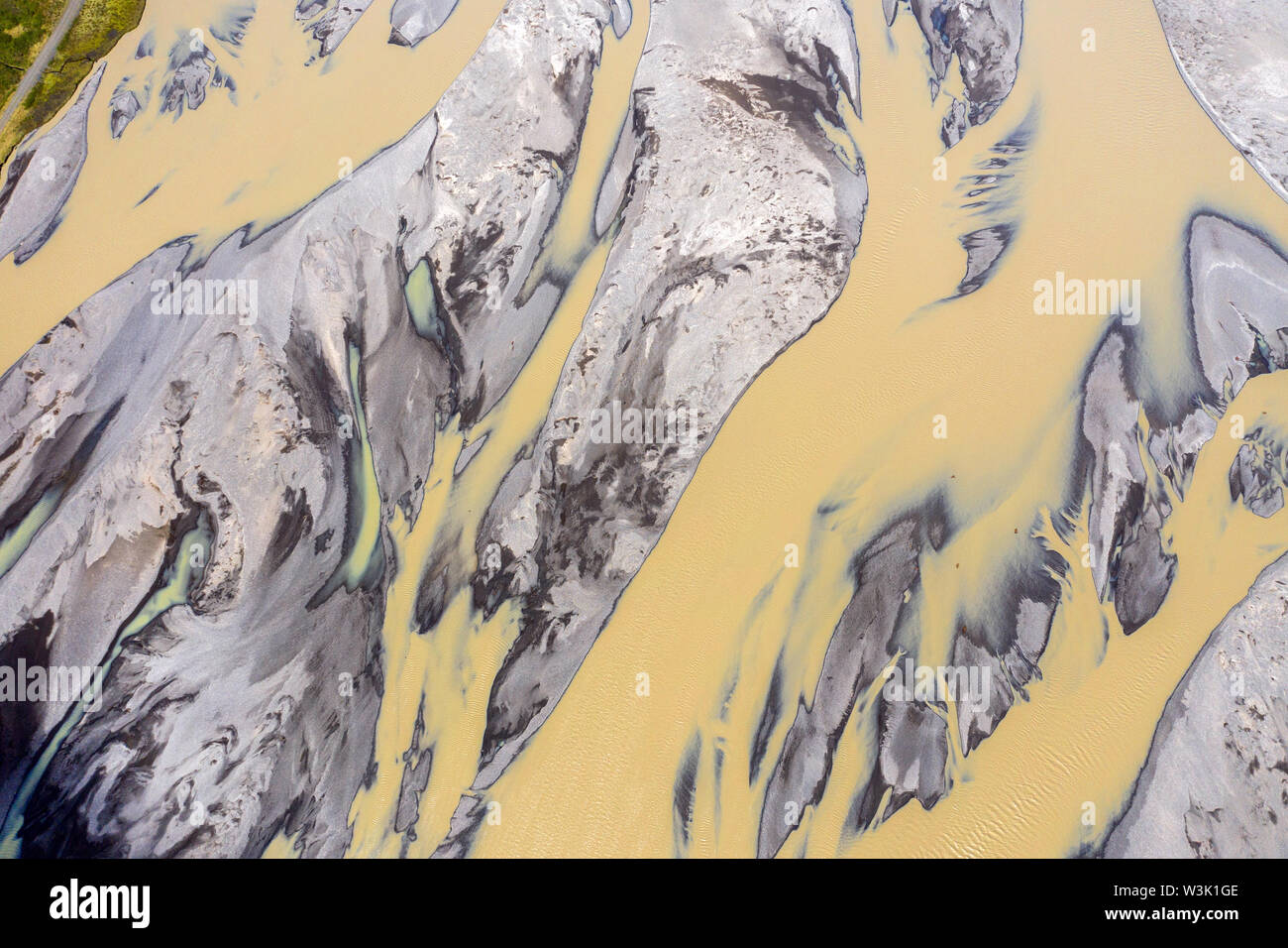 Aerial drone view of glacial river system transporting water from the ...