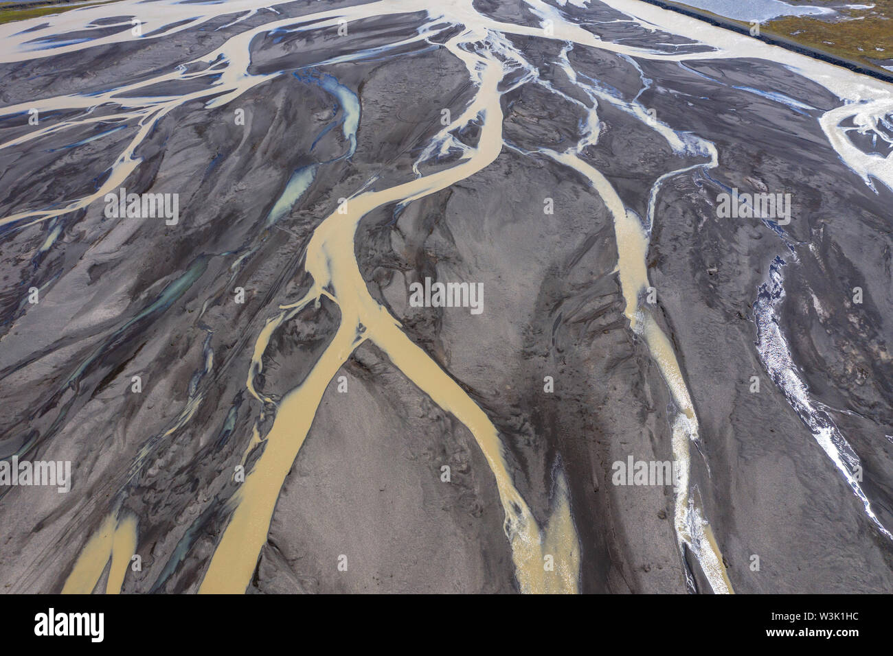 Aerial drone view of glacial river system transporting water from the ...