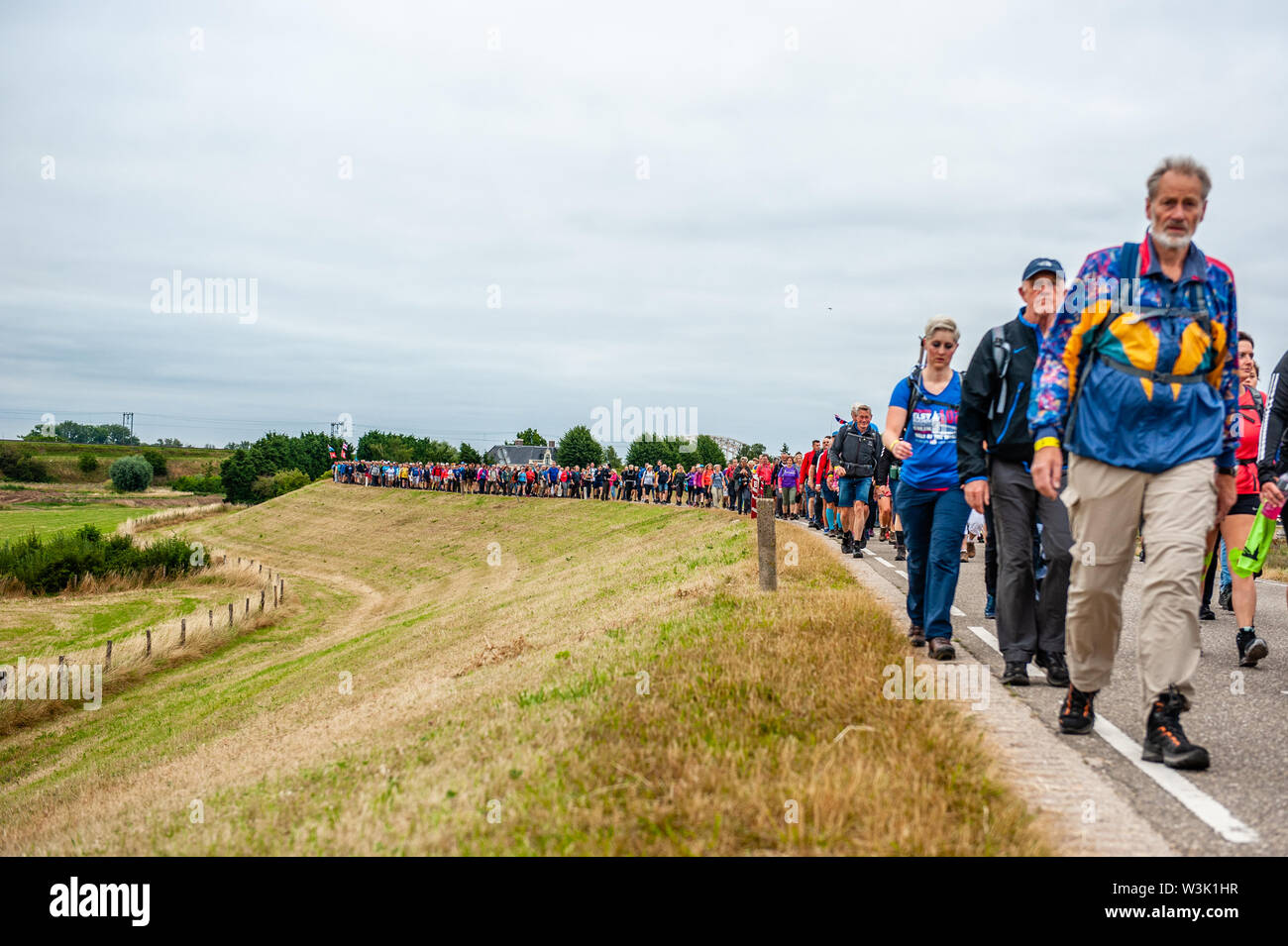 Four people in a queue hi-res stock photography and images - Alamy