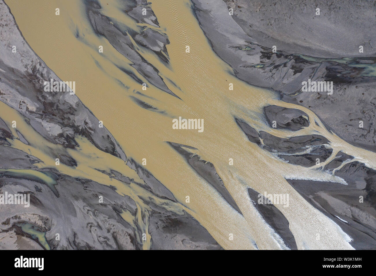 Aerial drone view of glacial river system transporting water from the ...