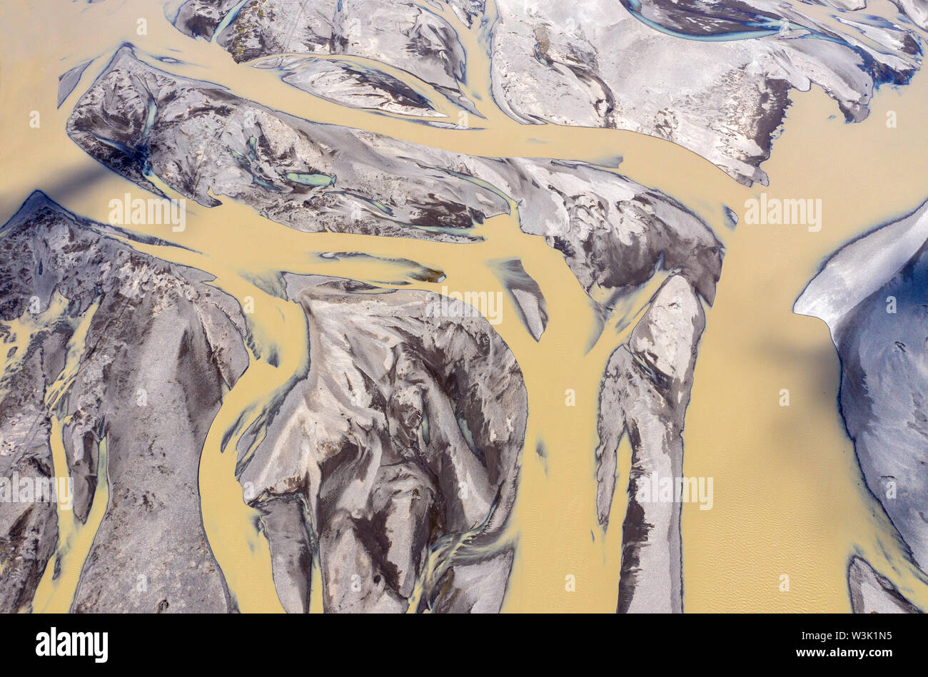 Aerial drone view of glacial river system transporting water from the ...