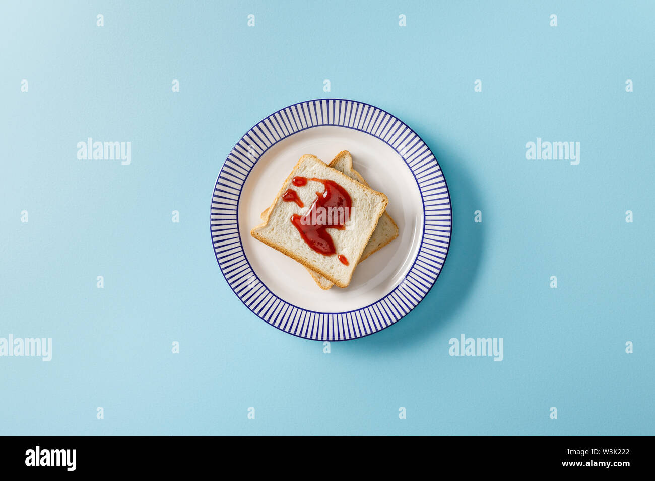 top view of toasts with jam on plate on blue background Stock Photo - Alamy