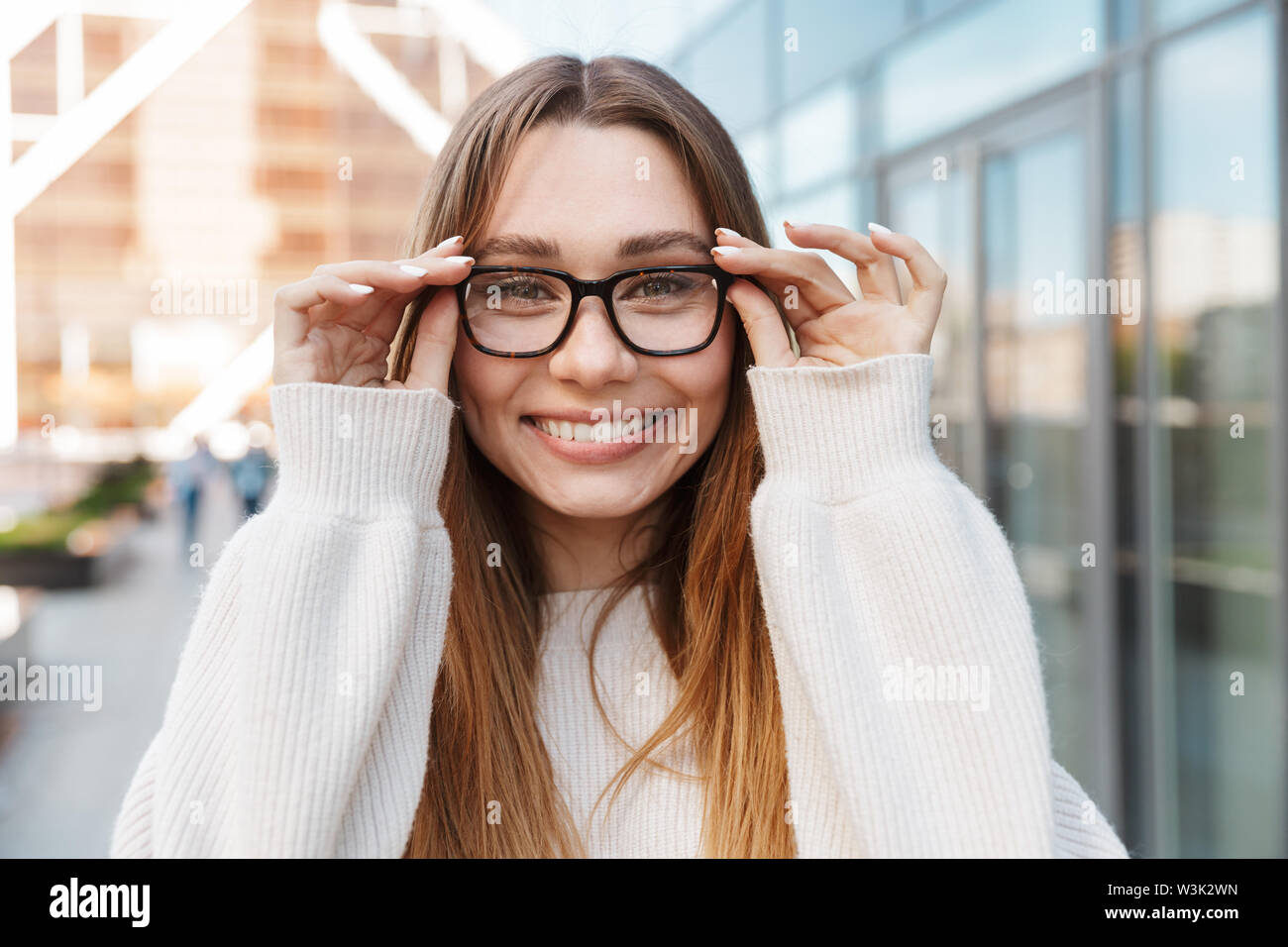 Image of a beautiful young happy excited business woman posing walking ...