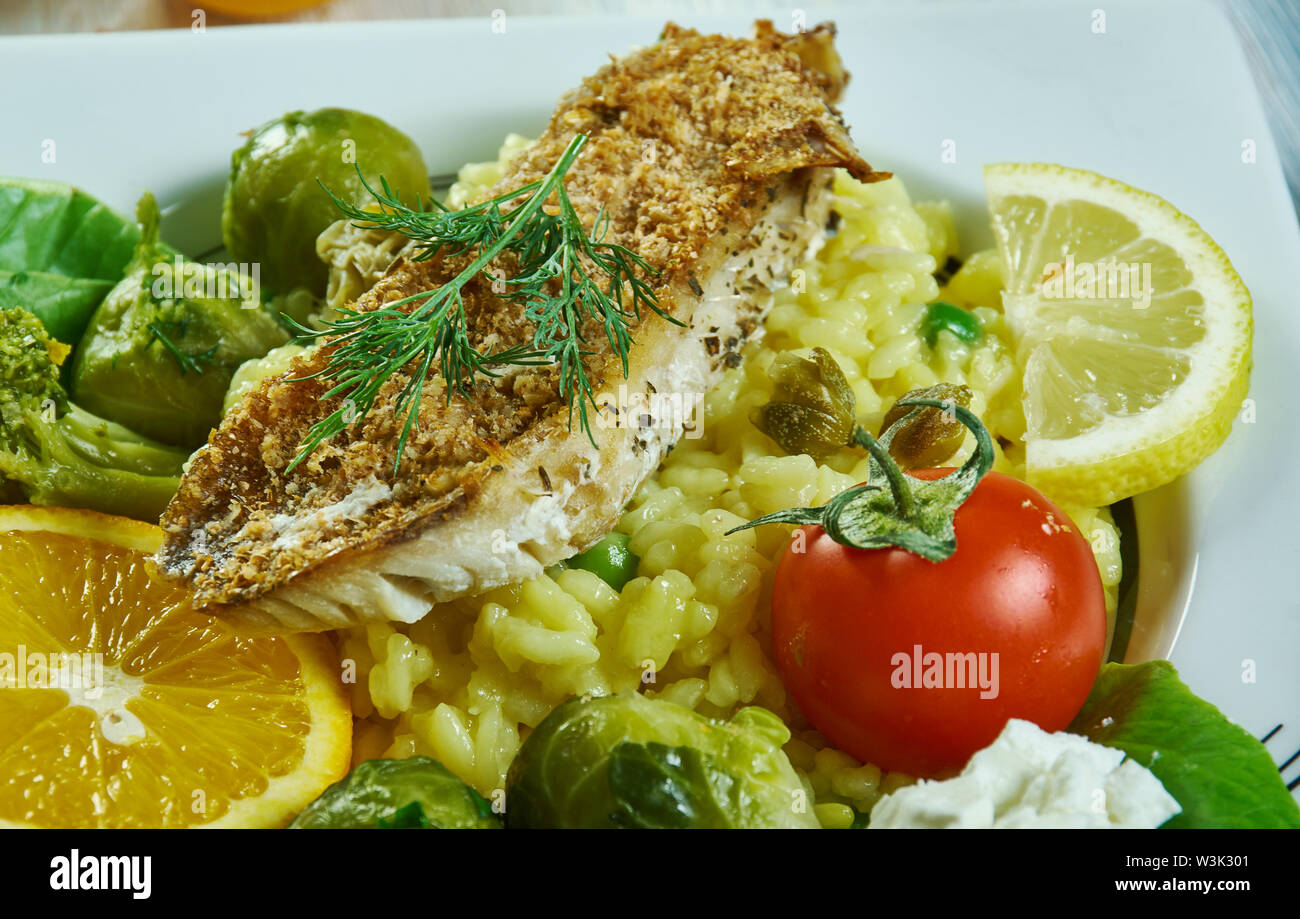 Crispy snapper with salsa verde risotto , Seafood risotto Stock Photo ...
