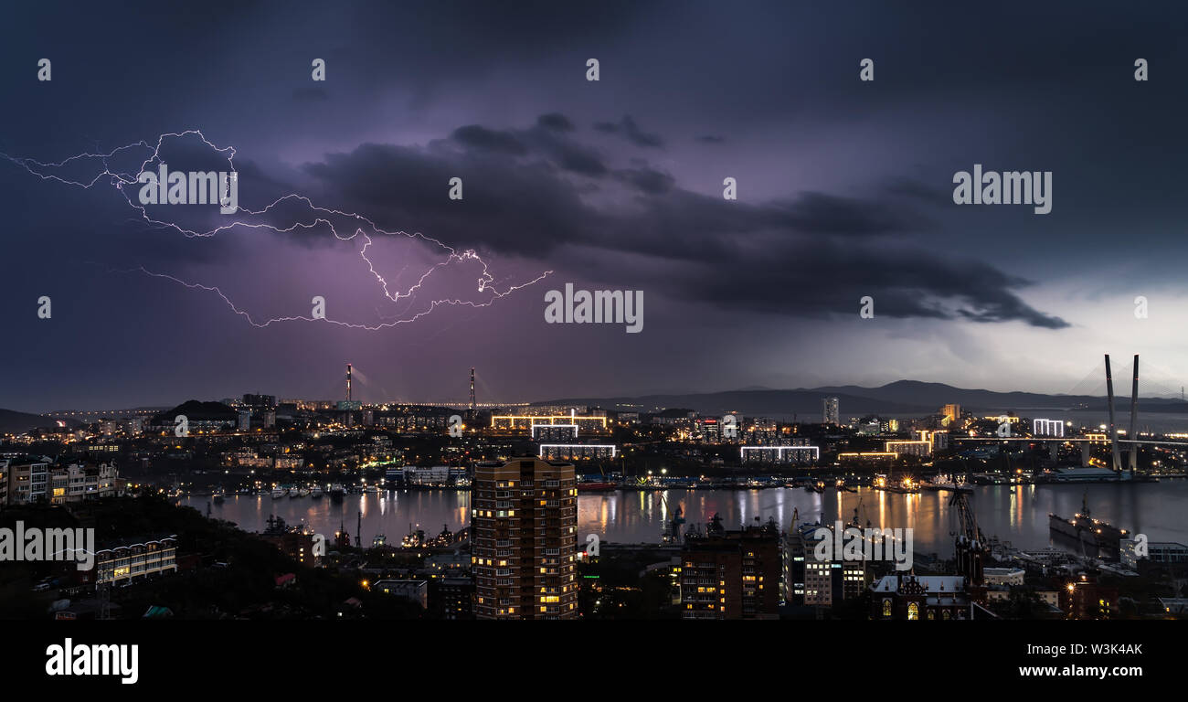 Lightning storm over city Stock Photo - Alamy