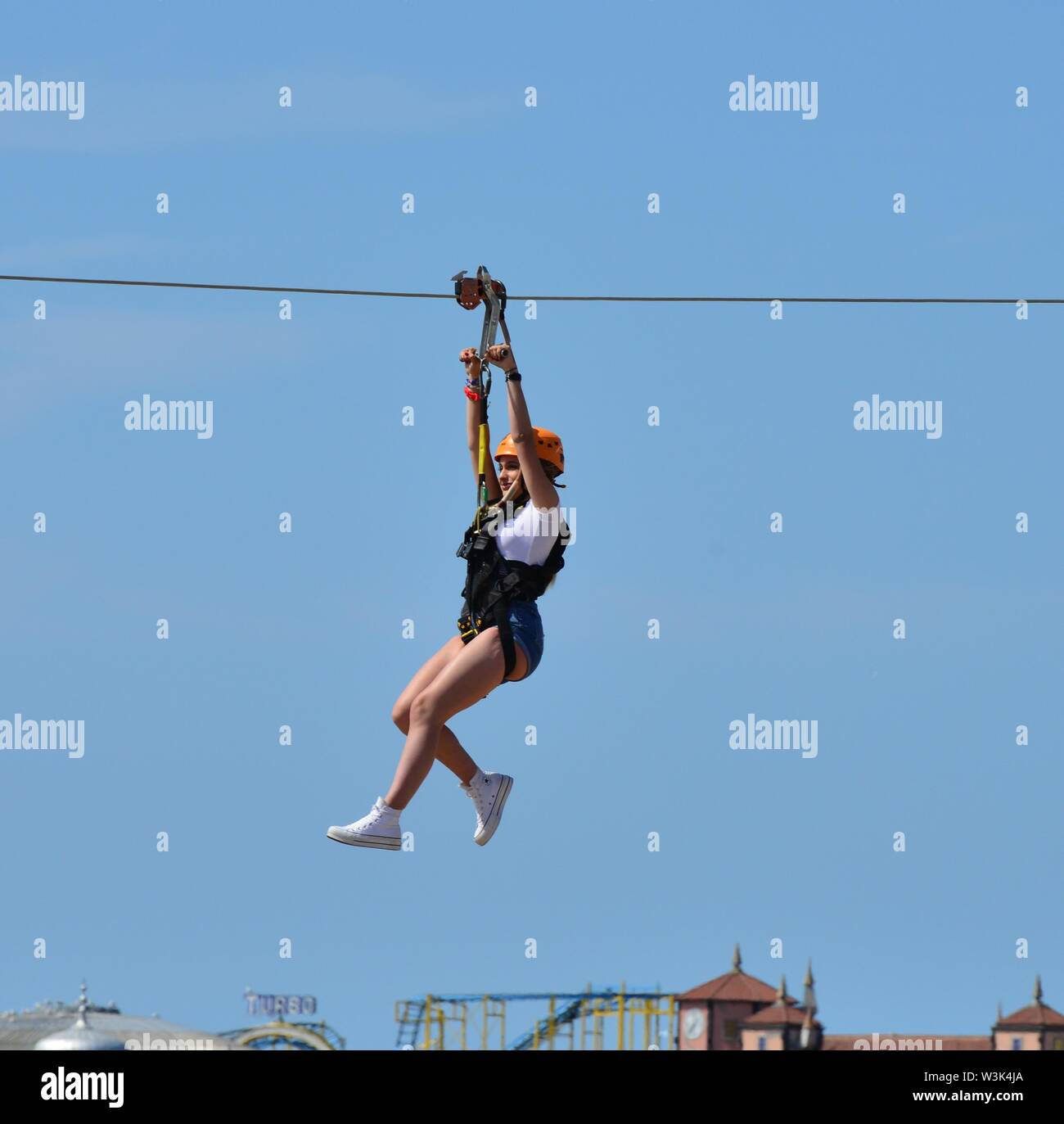 A lady zip wiring in Brighton Stock Photo - Alamy