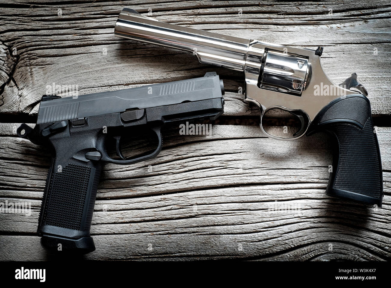 Handguns or pistols on old wood texture weapons for self defense Stock ...