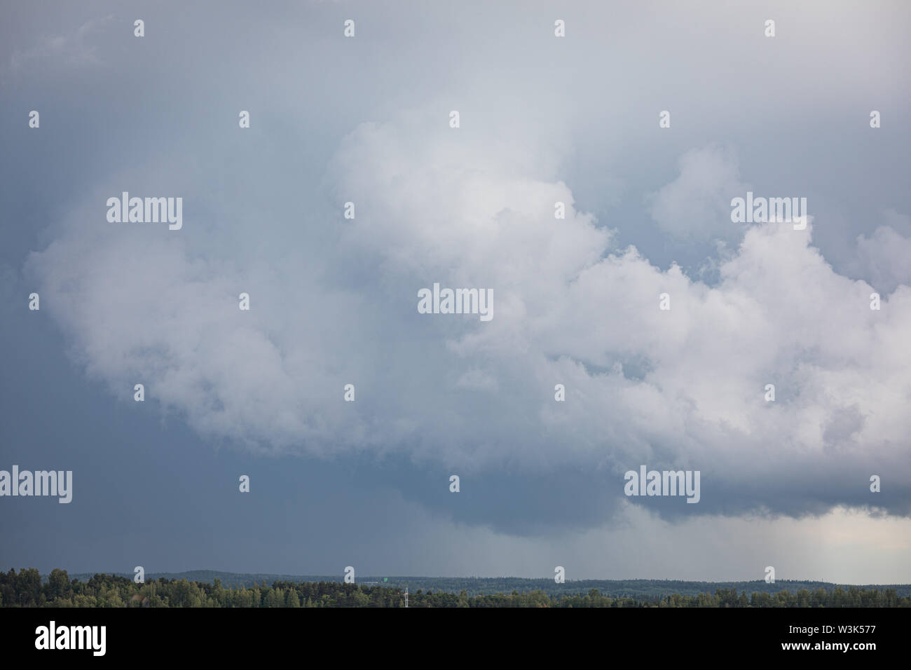 Summer day raining viewed from far Stock Photo - Alamy