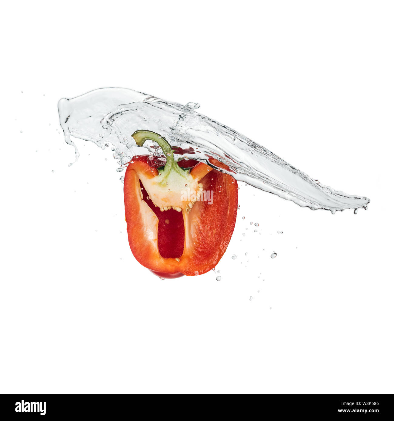 red bell pepper half with clear water stream isolated on white Stock ...