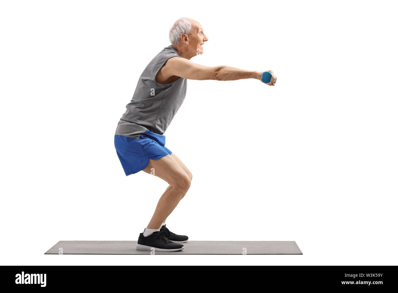Full length profile shot of a senior man exercising squats and holding ...
