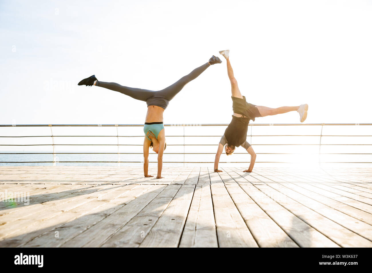 Two People Doing A Cartwheel