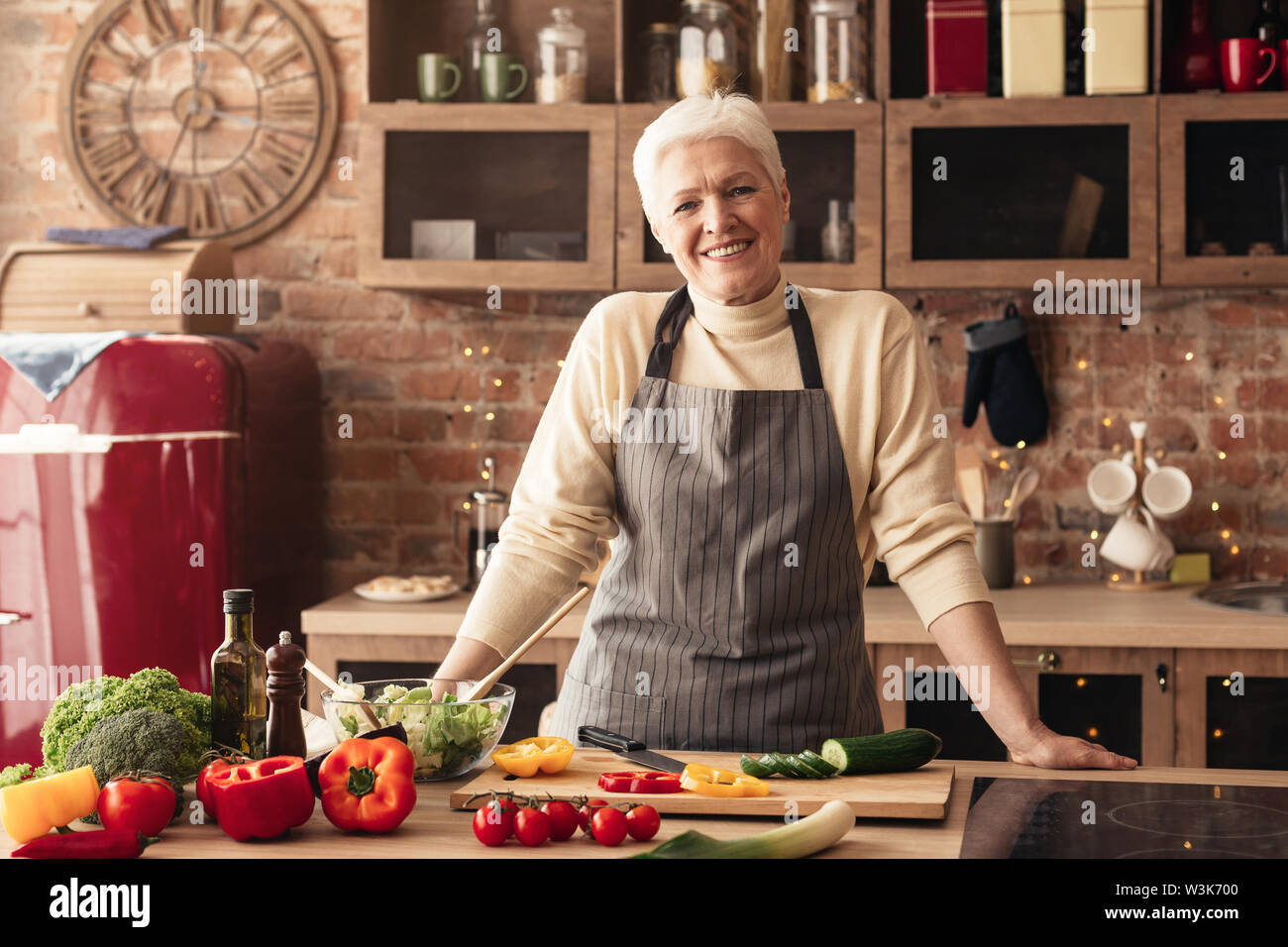Old lady cooking hi-res stock photography and images - Alamy