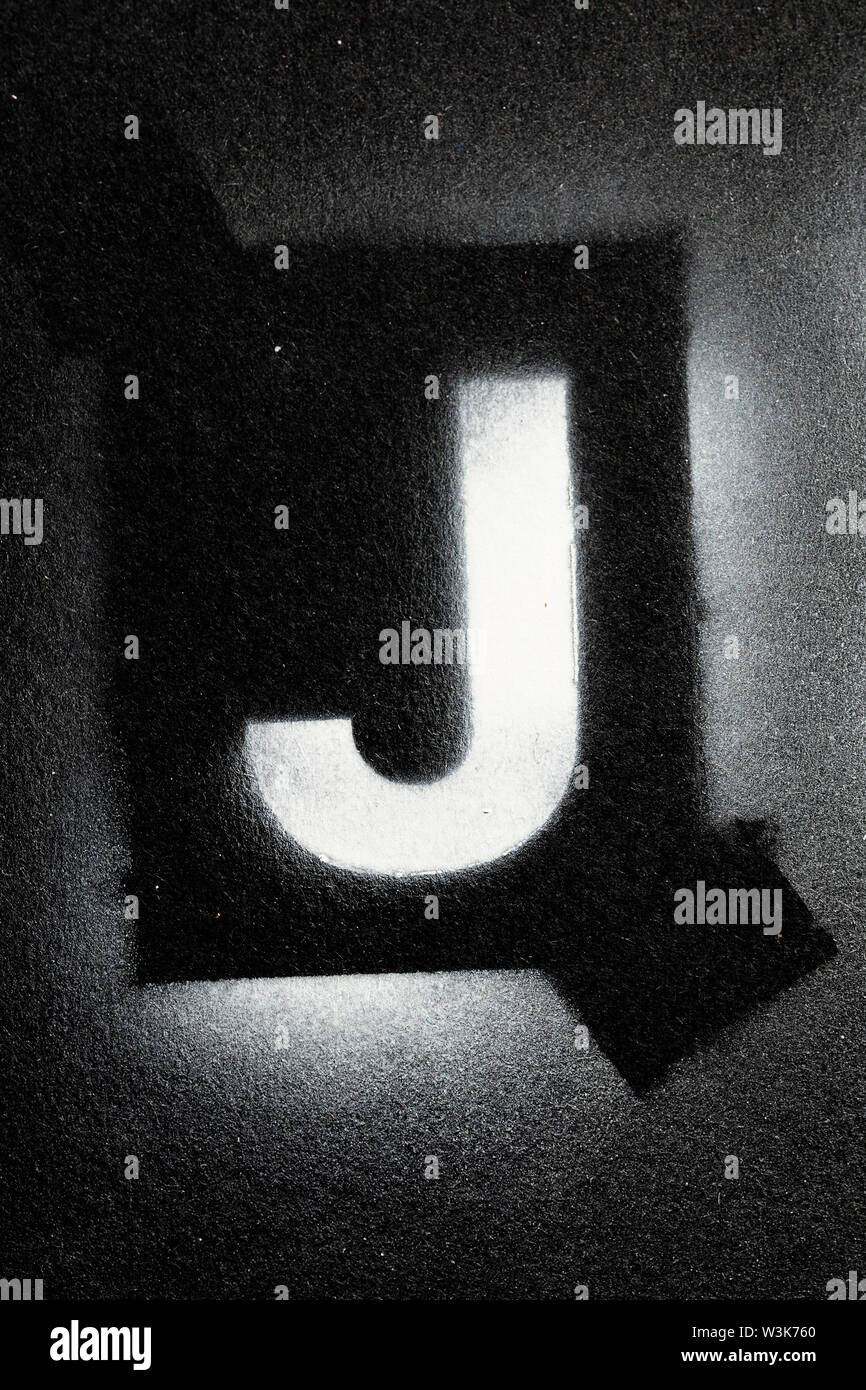 Letter J grunge spray paninted stencil font Stock Photo - Alamy