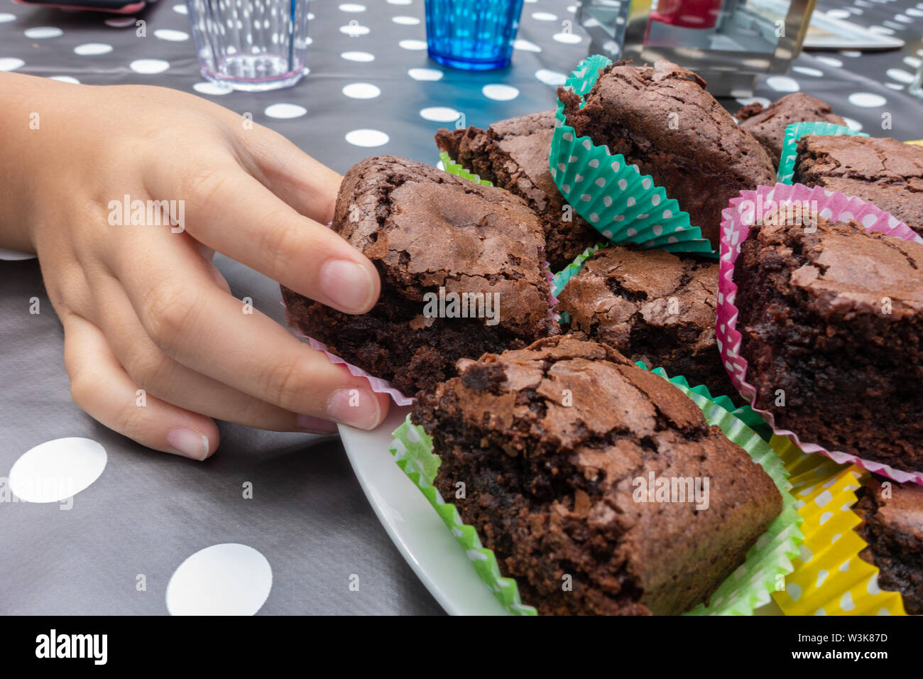 Hand reaching cake hi-res stock photography and images - Alamy