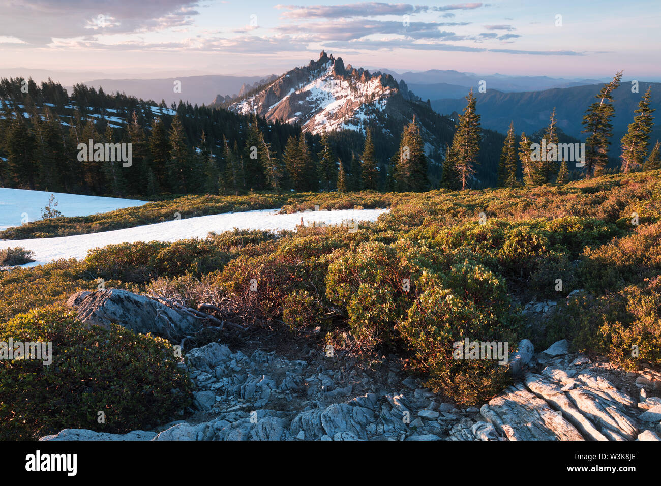 Rocky mountains covered with the last snow near Mount Shasta volcano ...