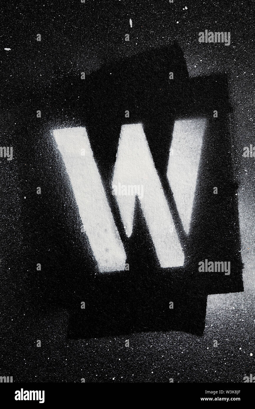 Letter W grunge spray paninted stencil font Stock Photo - Alamy