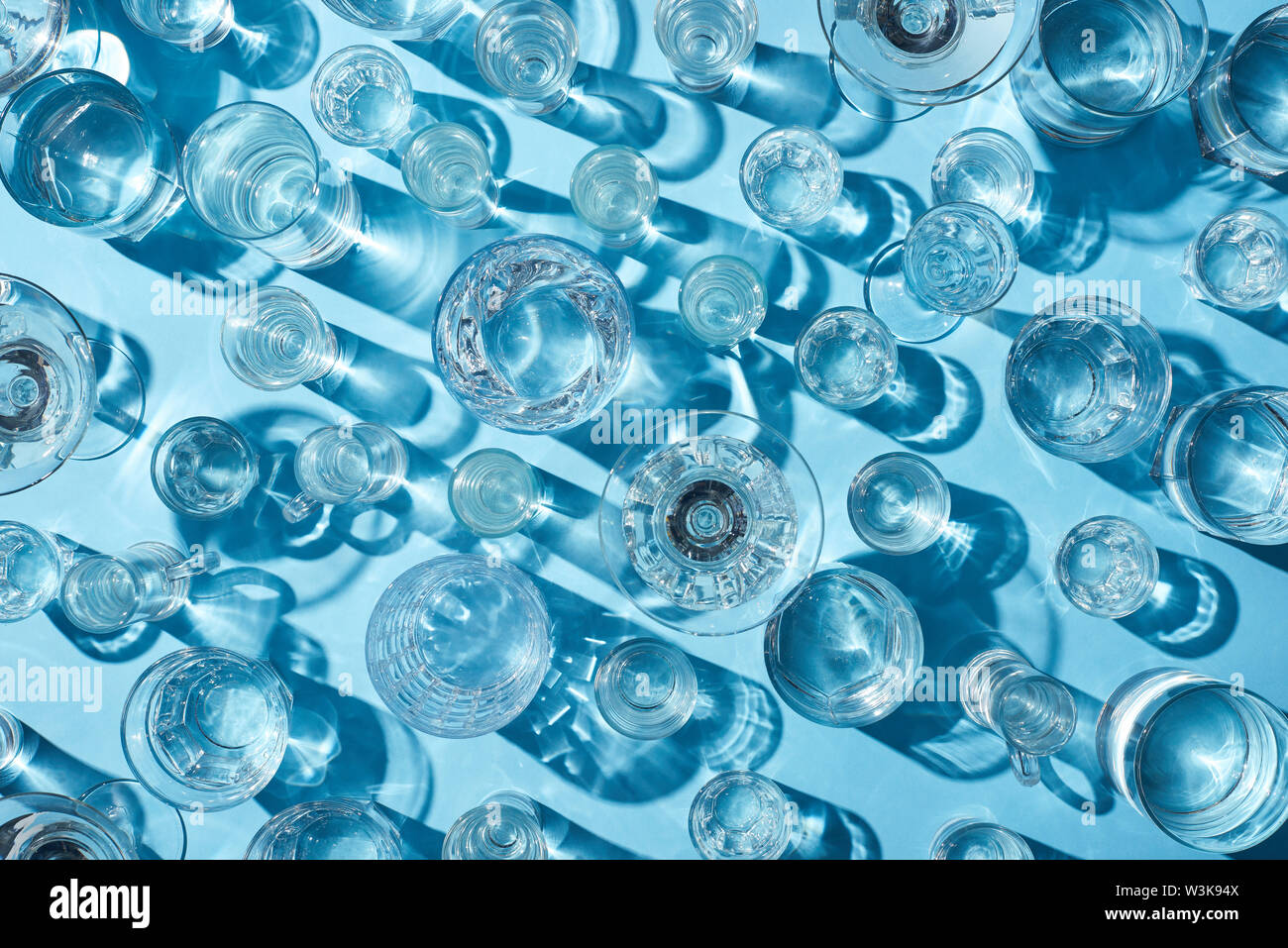 top view of glasses with transparent water on white surface Stock Photo ...