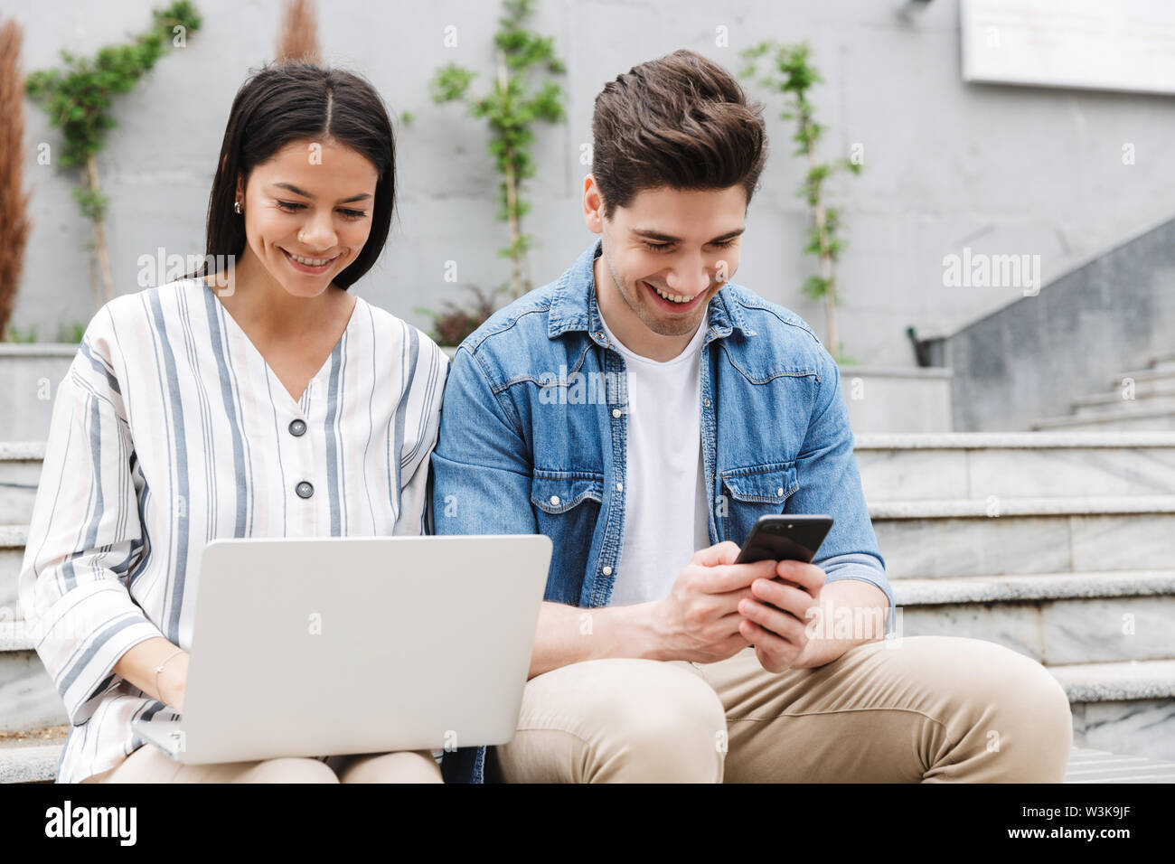 Image of happy young amazing loving couple business people colleagues ...