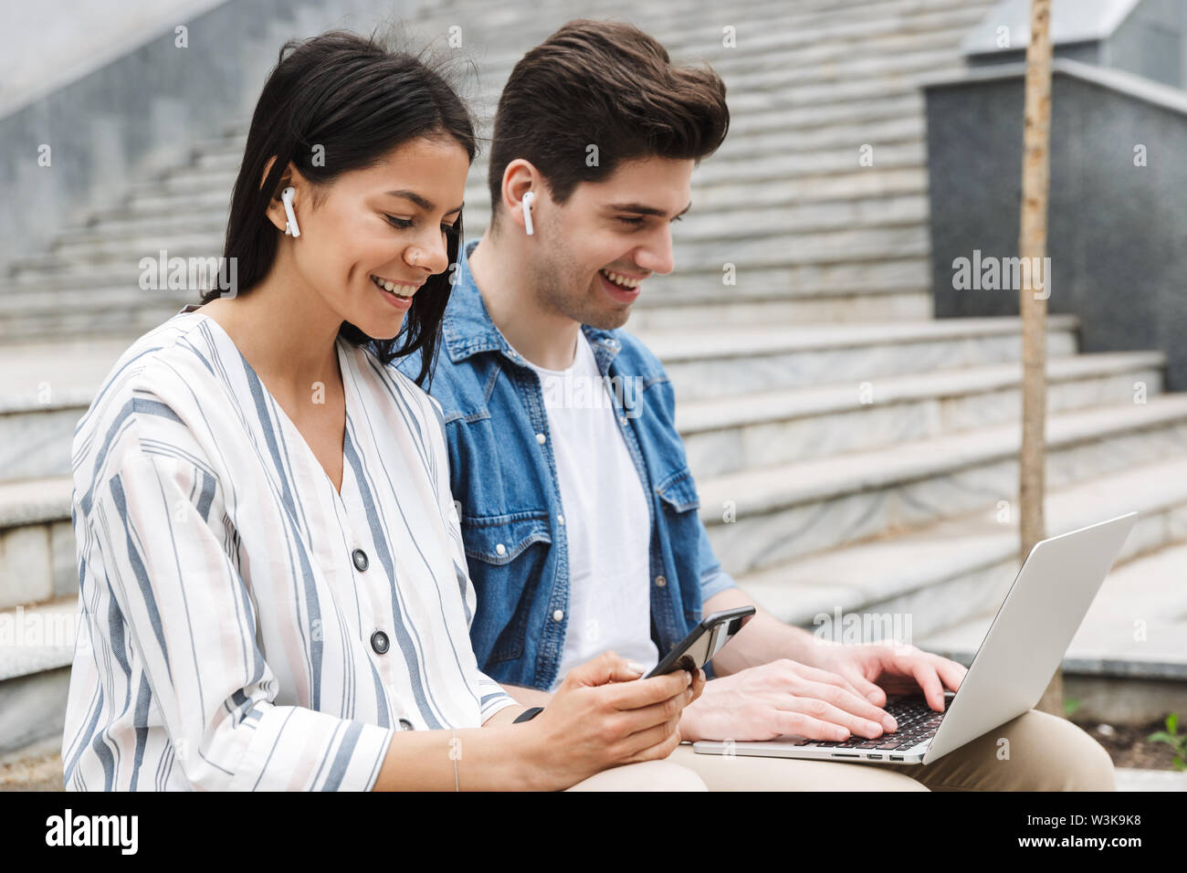 Image of happy young amazing loving couple business people colleagues ...