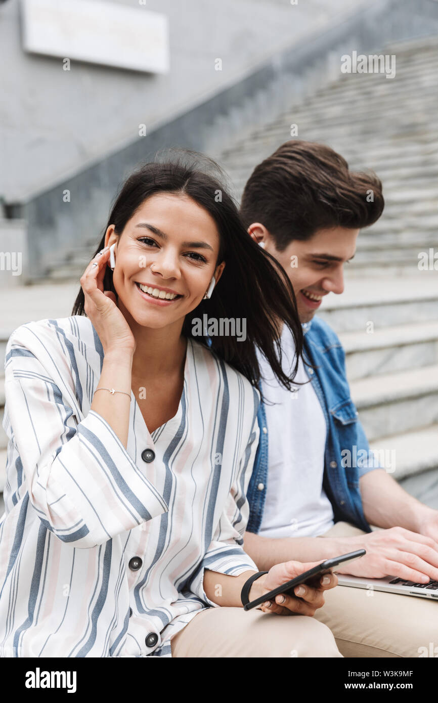 Image of happy young amazing loving couple business people colleagues ...